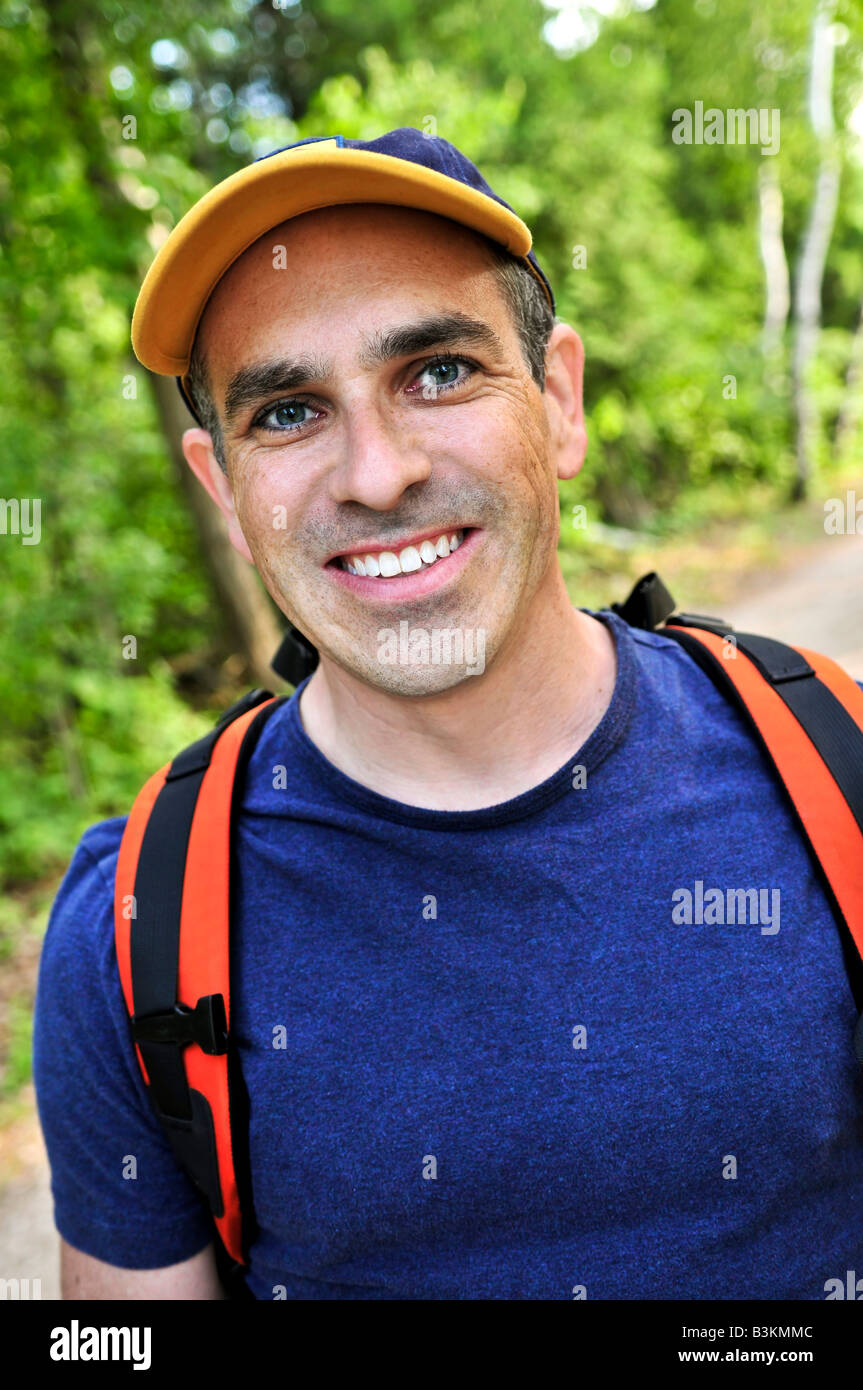 Portrait of happy middle aged man on a forest trail Stock Photo - Alamy