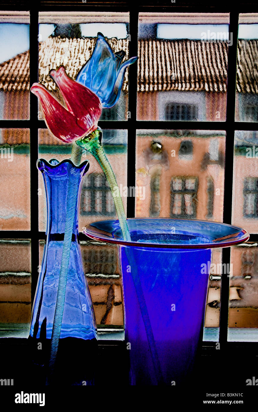 Glass flowers in window Stock Photo - Alamy