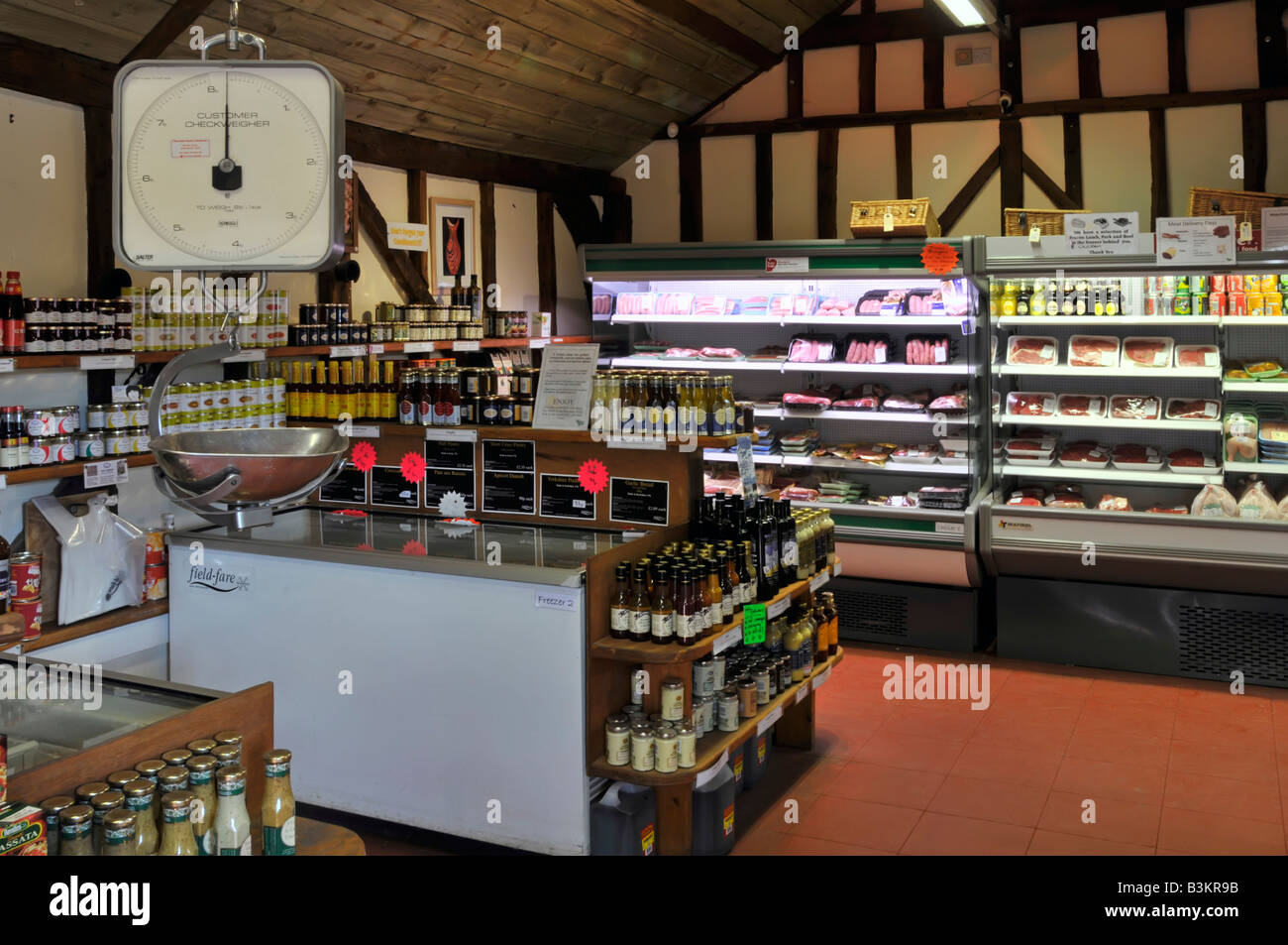 Interior of Calcott Hall retail farm shop assorted produce displays on ...