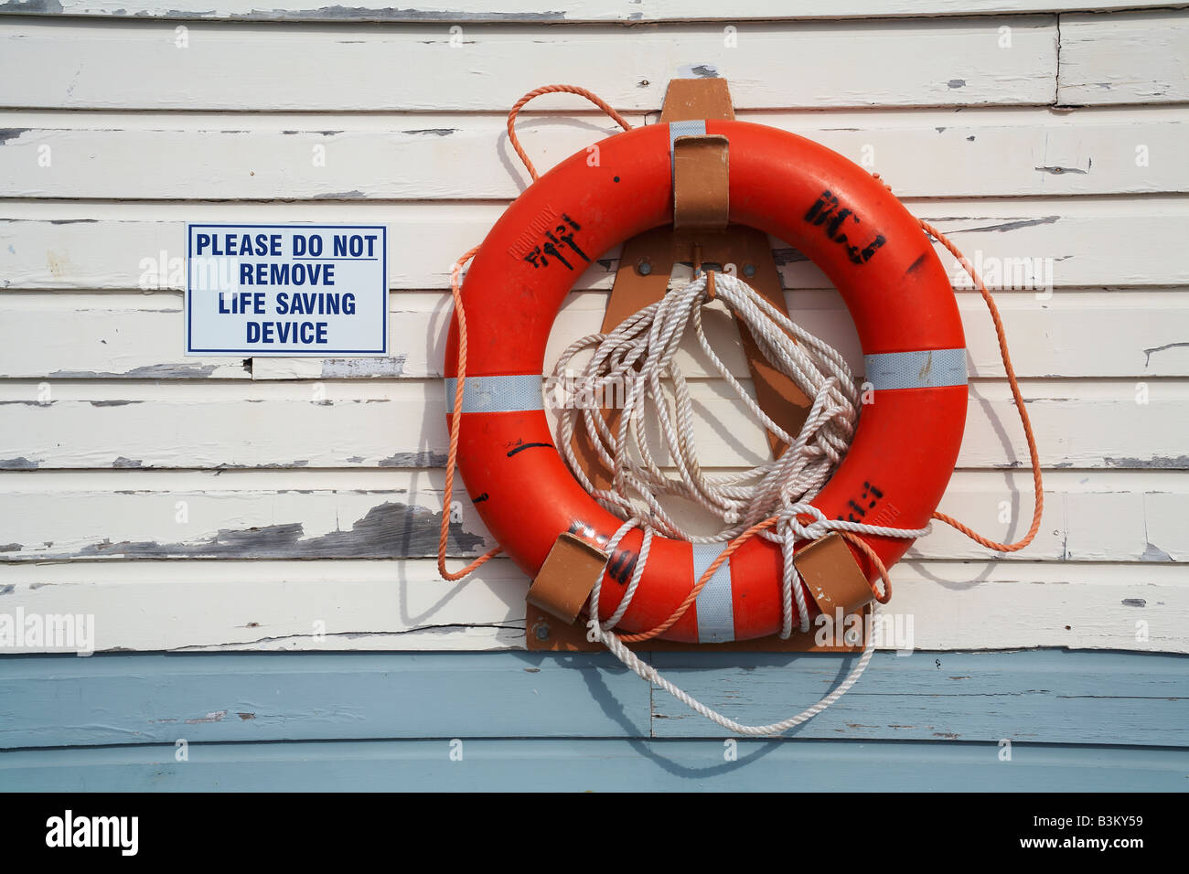 A Life Belt And A Warning Sign High Resolution Stock Photography and ...