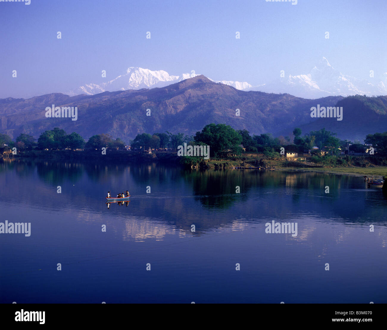 Pokhara - Boating scene on Lake Phewa Tal overlooked by Fishtail ...