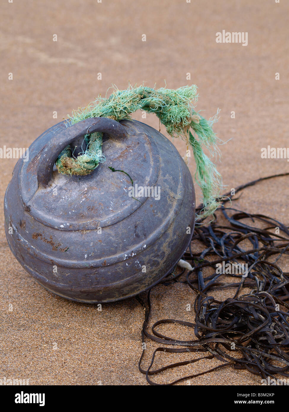 Old metal float from a fishing trawlers net float was made in Spain and ...