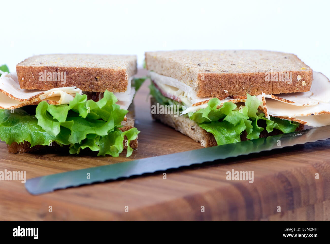 A fresh deli sandwich with lots of meat and green lettuce Stock Photo ...