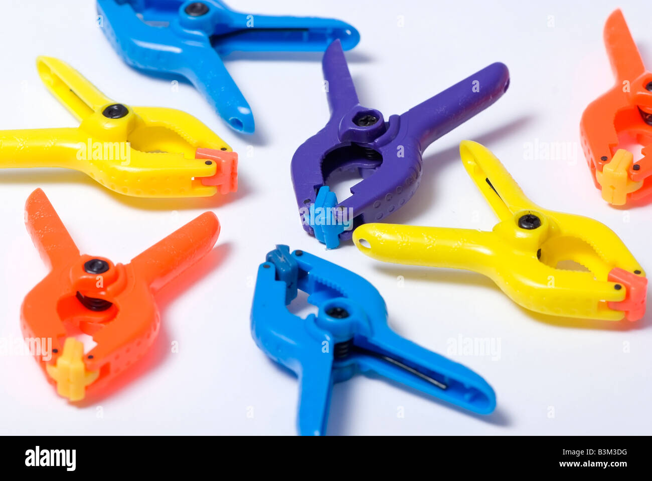 A set of colorful clamps up close Stock Photo - Alamy
