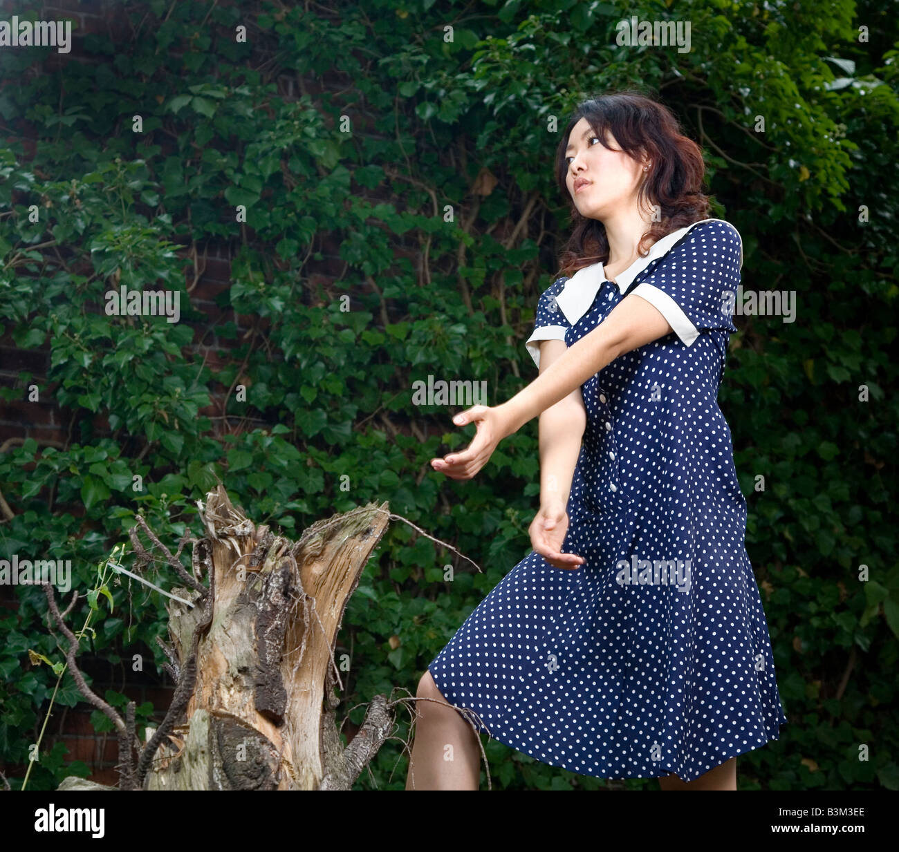 a japanese woman dancing on tree trunks Stock Photo - Alamy