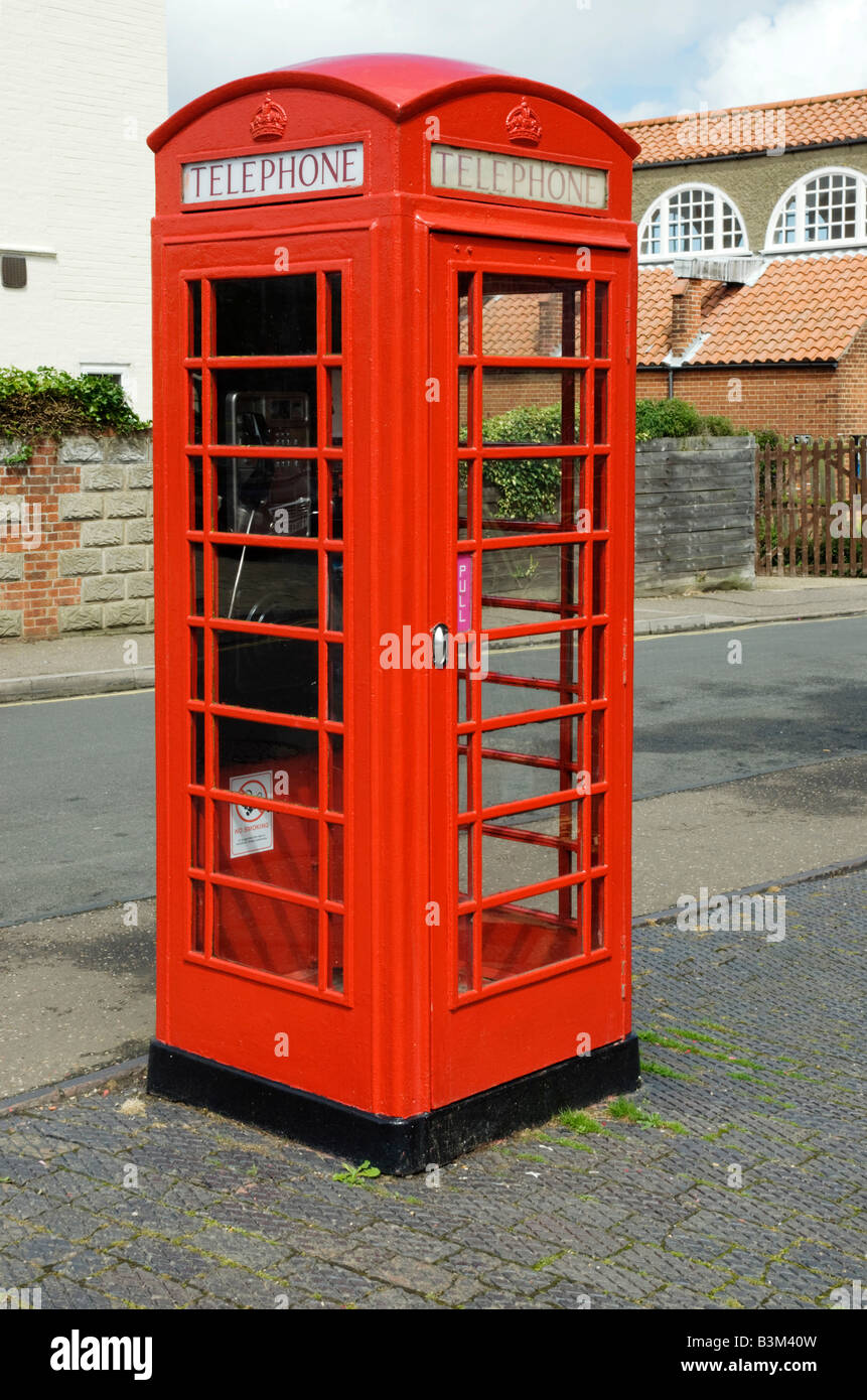 Traditional British red telephone box in urban setting Stock Photo - Alamy