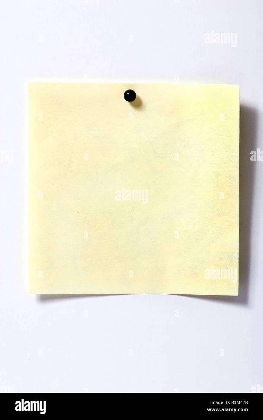 A small yellow post it ready to fill out white background Stock Photo ...