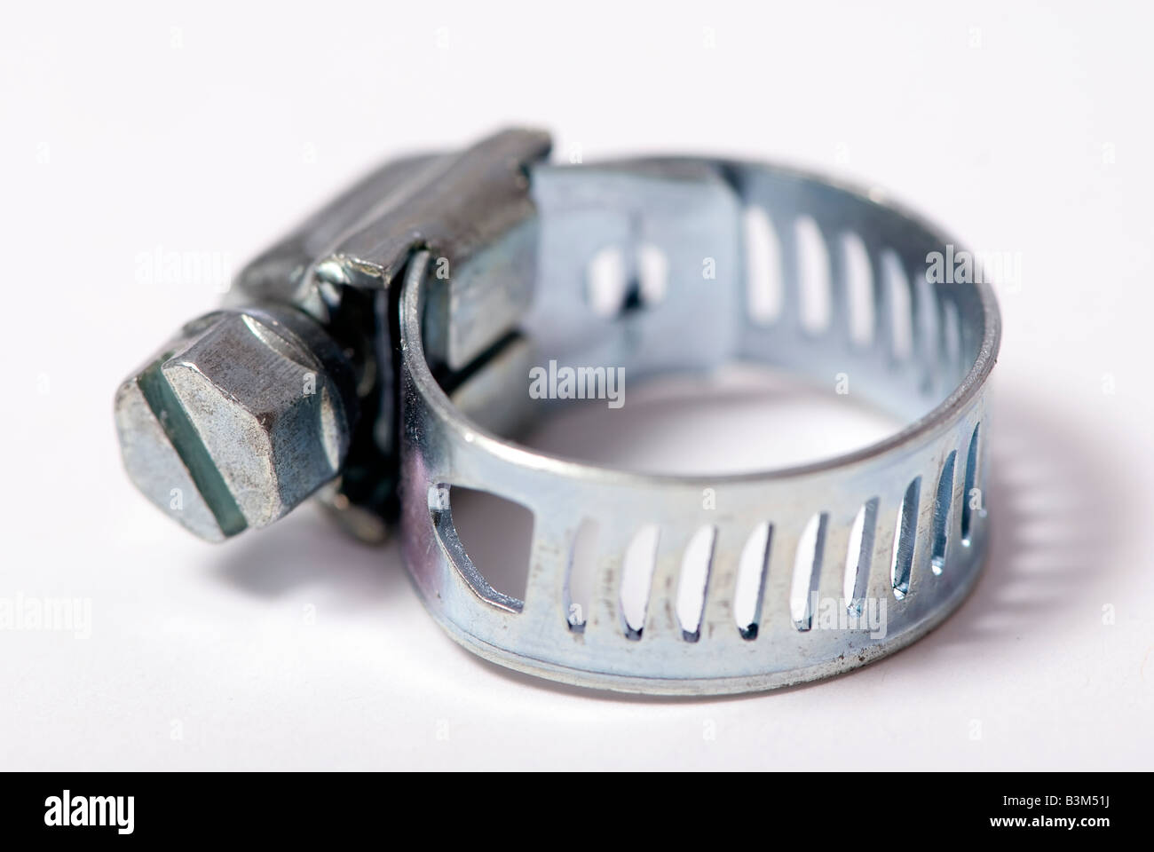 A close up a a small hose clamp Stock Photo - Alamy