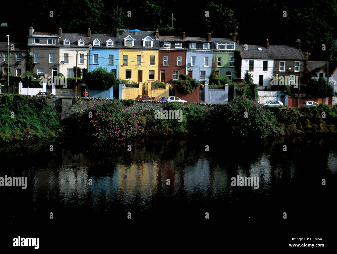 ireland cork city colorful terrace of houses reflected in river lee ...