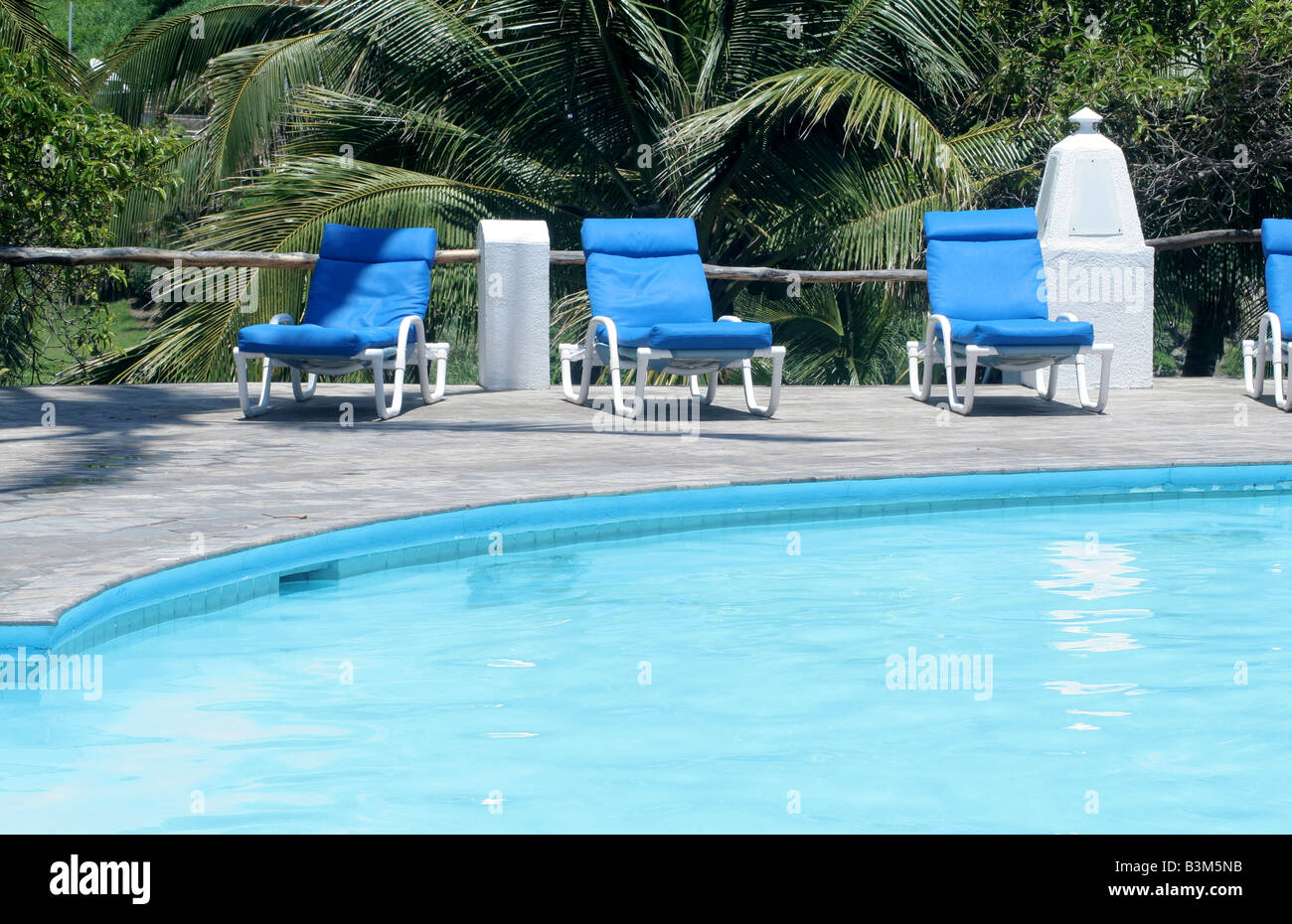 Lounge chairs by a hotel pool in Mexico Stock Photo - Alamy