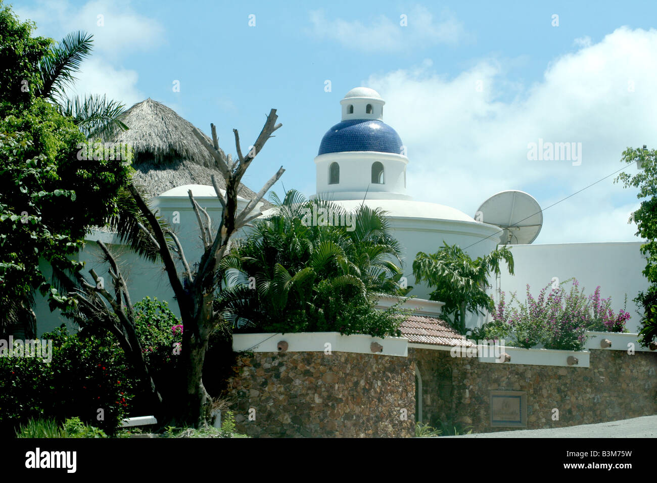 A large luxury tropical mediterranean style home Stock Photo - Alamy