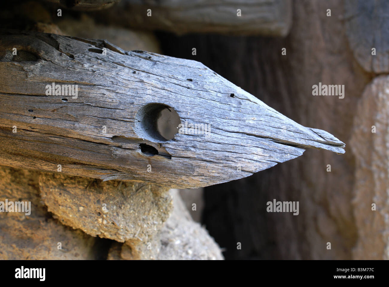 A wooden plank with a hole Stock Photo - Alamy