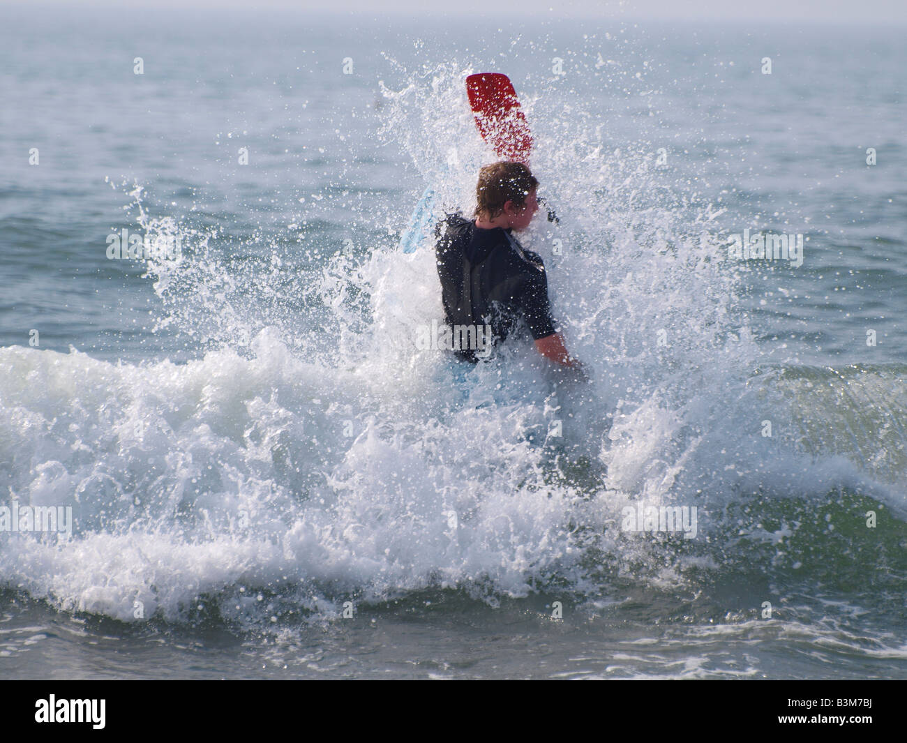 Male Kayaker paddling through a breaking wave Stock Photo - Alamy