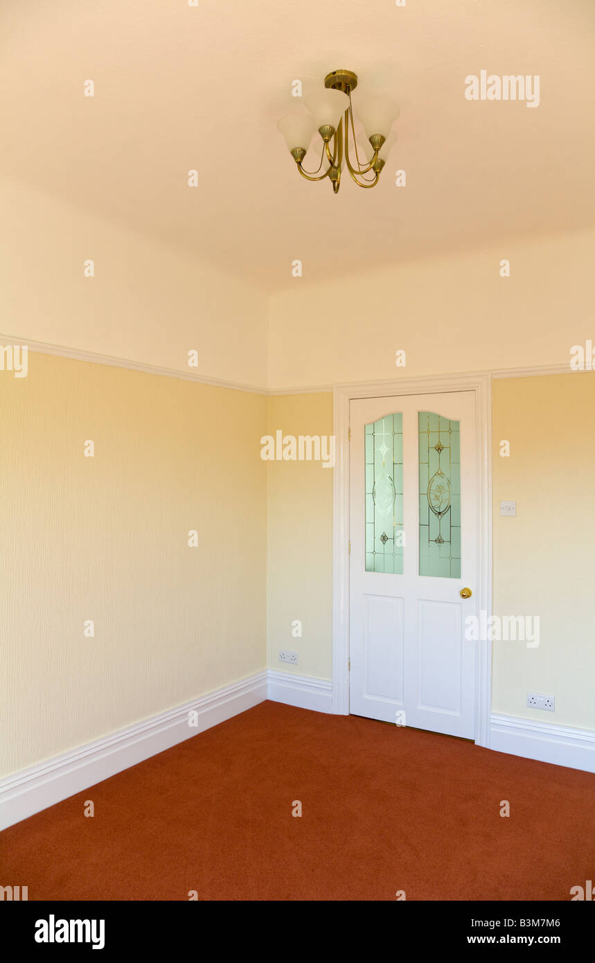 Empty room with half glazed door Stock Photo - Alamy