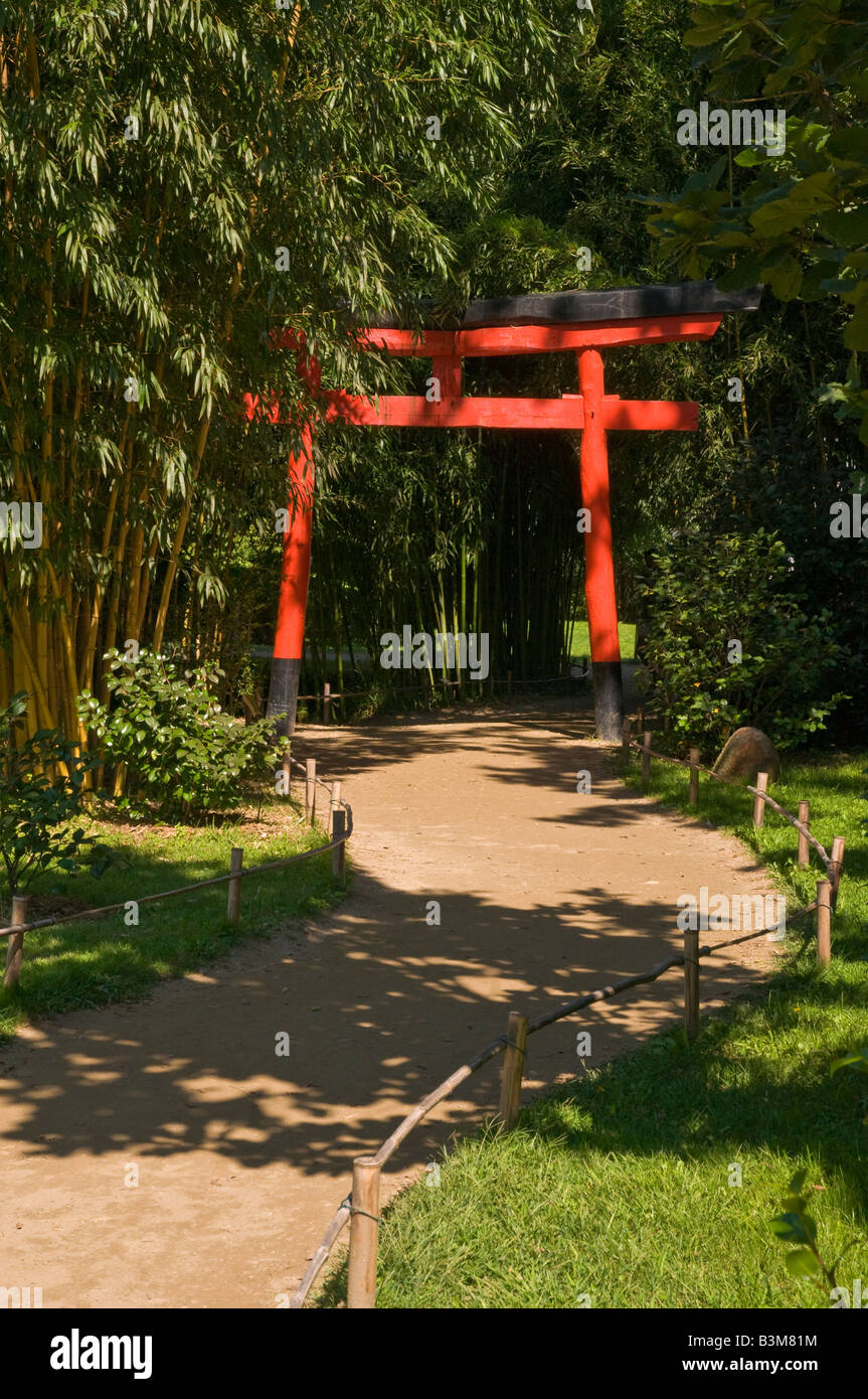 Bright red japanese style torii gate in a garden in France Stock Photo ...