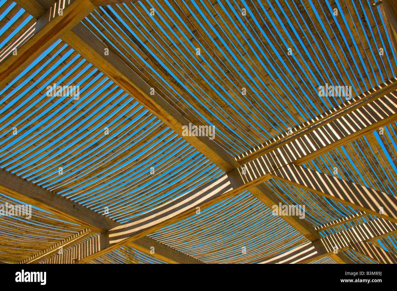 A bamboo sun screen over a patio against the blue summer sky Stock ...