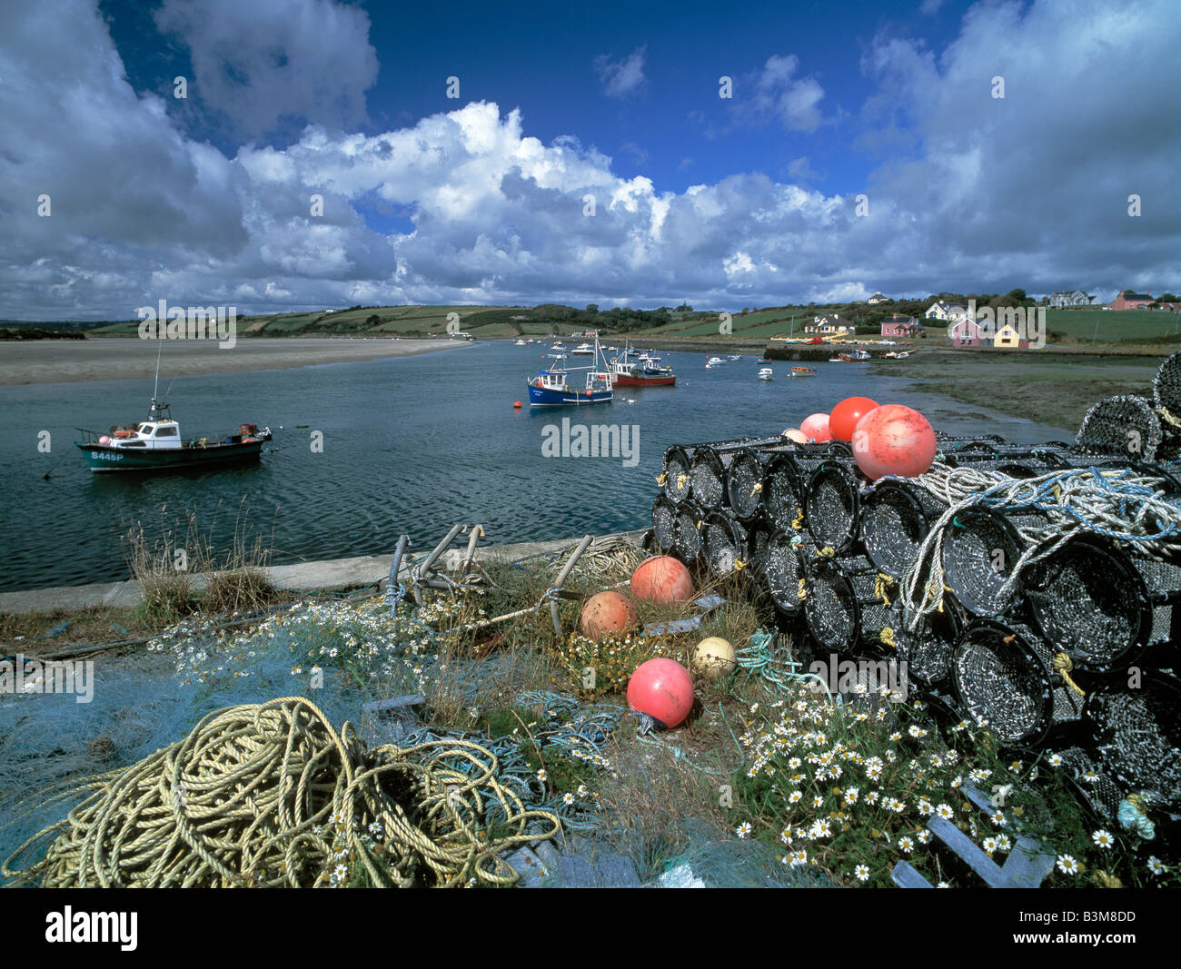 clonakilty sea inlet, county cork, fish traps lying on pier quays in ...