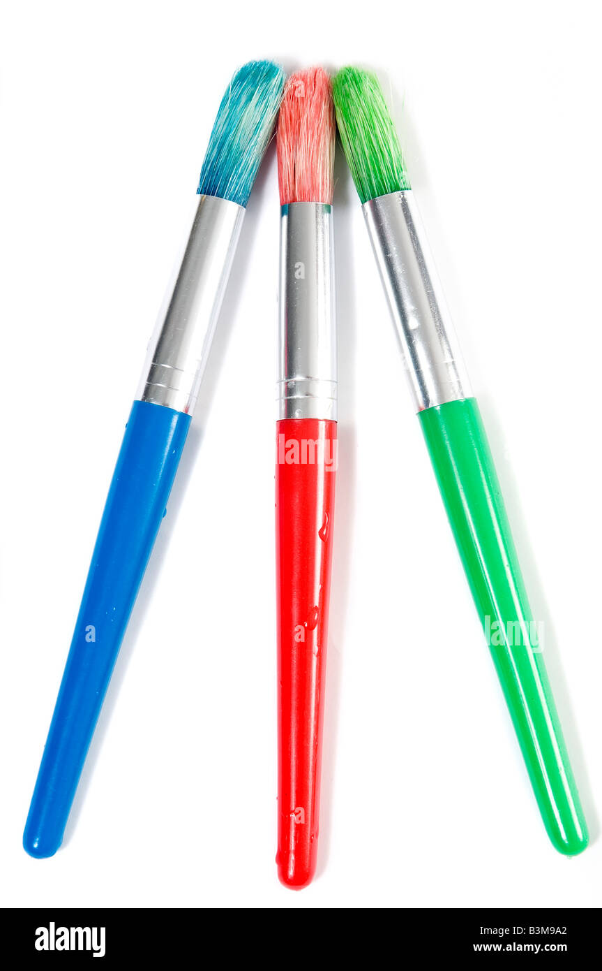 The tips of three colorful paintbrushes ready to be used Stock Photo ...
