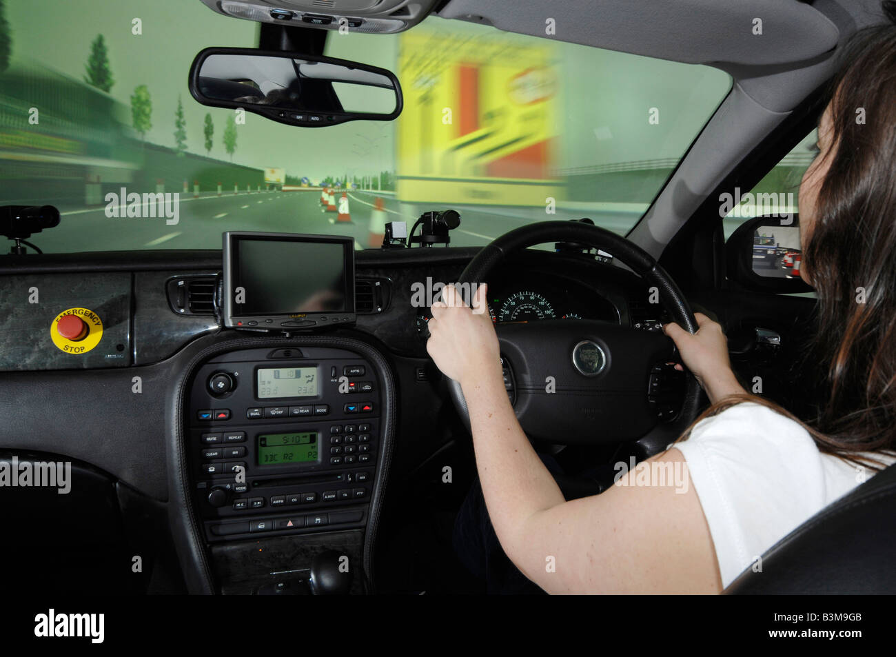 Woman in a driving simulator Stock Photo - Alamy