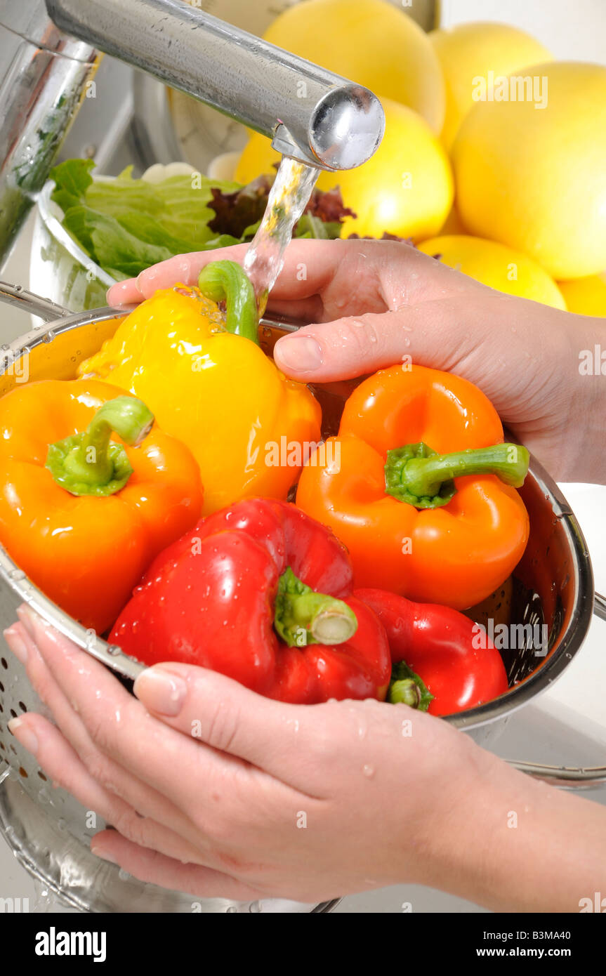 WASHING MIXED PEPPERS IN COLLANDER Stock Photo - Alamy