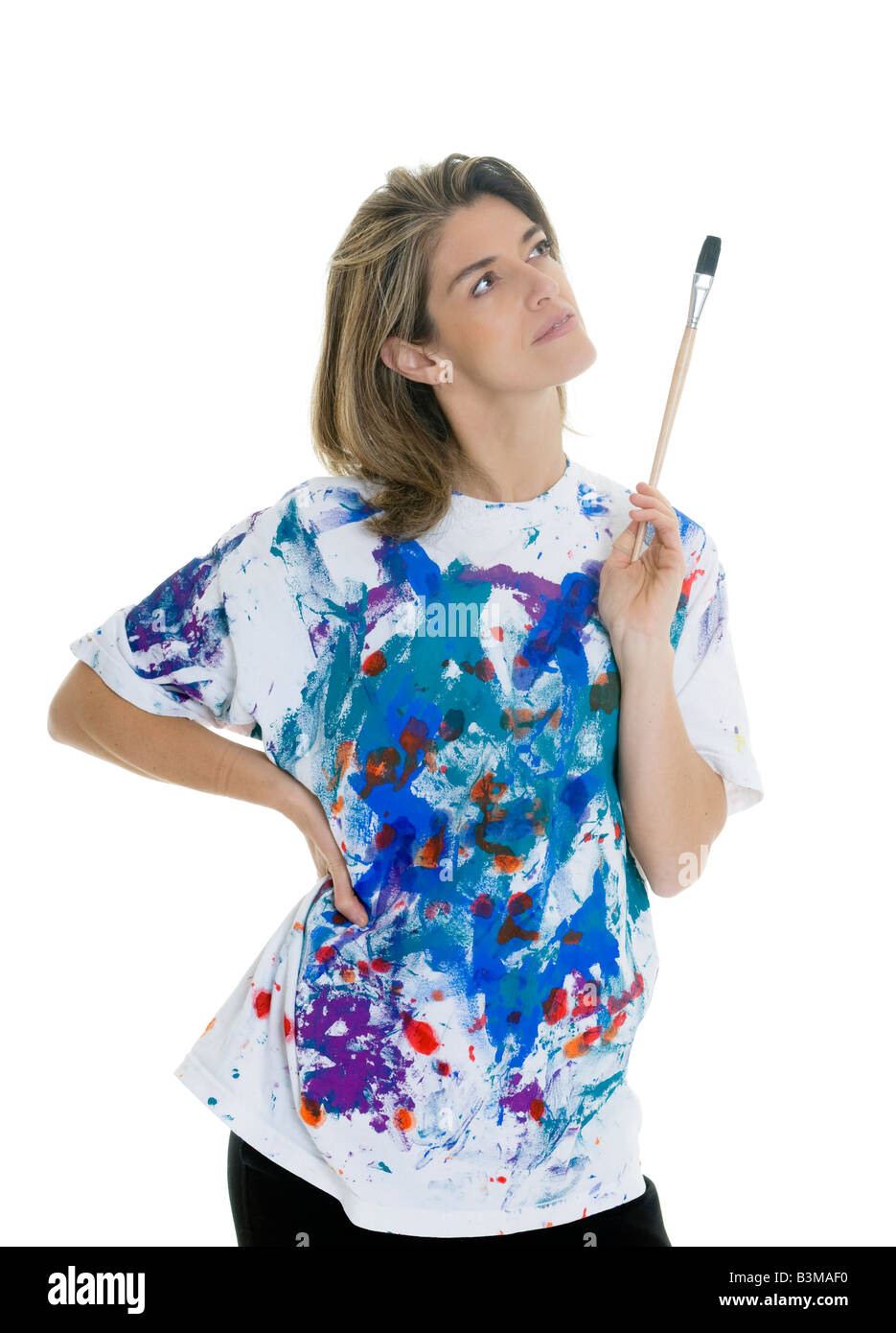 A woman having fun painting her masterpiece Stock Photo - Alamy