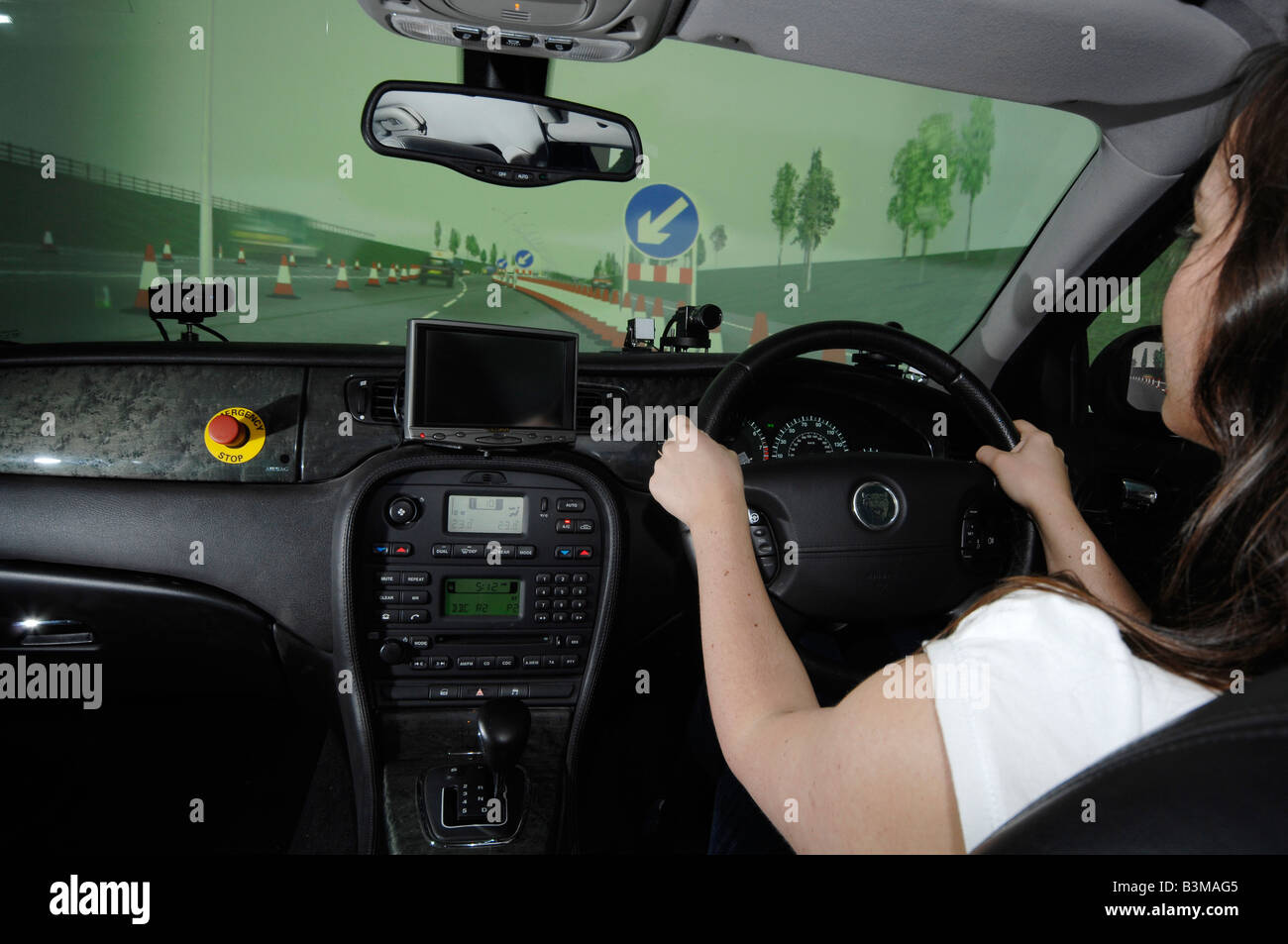 Woman in a driving simulator Stock Photo - Alamy