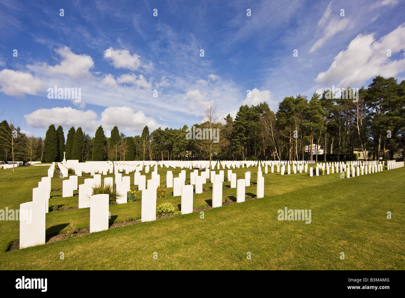 Canadian Military Cemetery Grave Markers under Blue Sky with Cross of ...