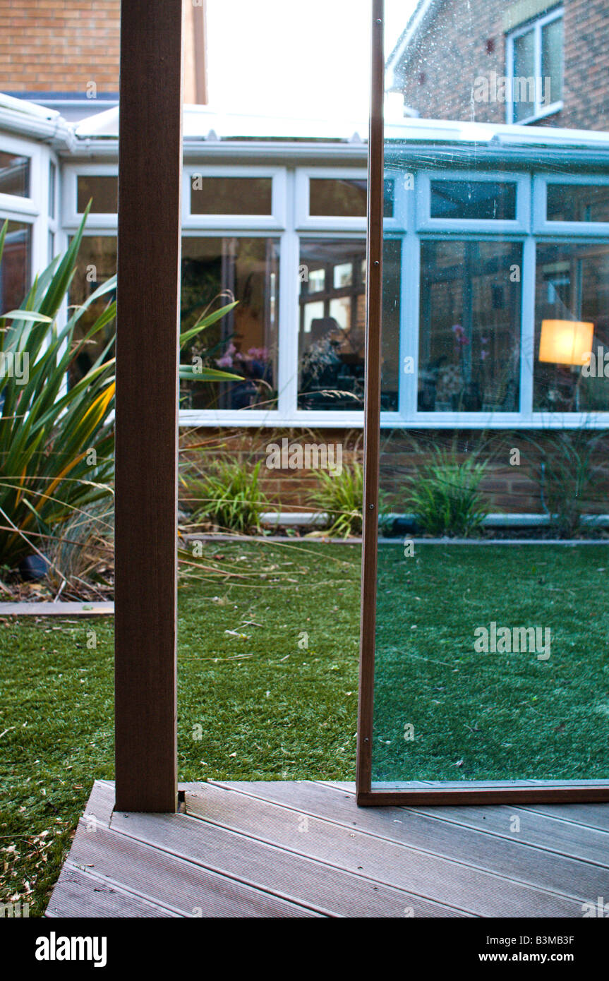 tinted perspex and wood gazebo in landscaped garden Stock Photo - Alamy