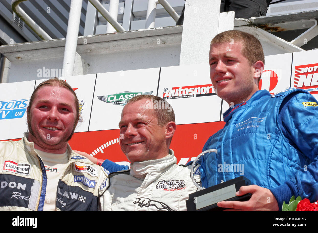 Three winning racing drivers at classic car day Stock Photo - Alamy