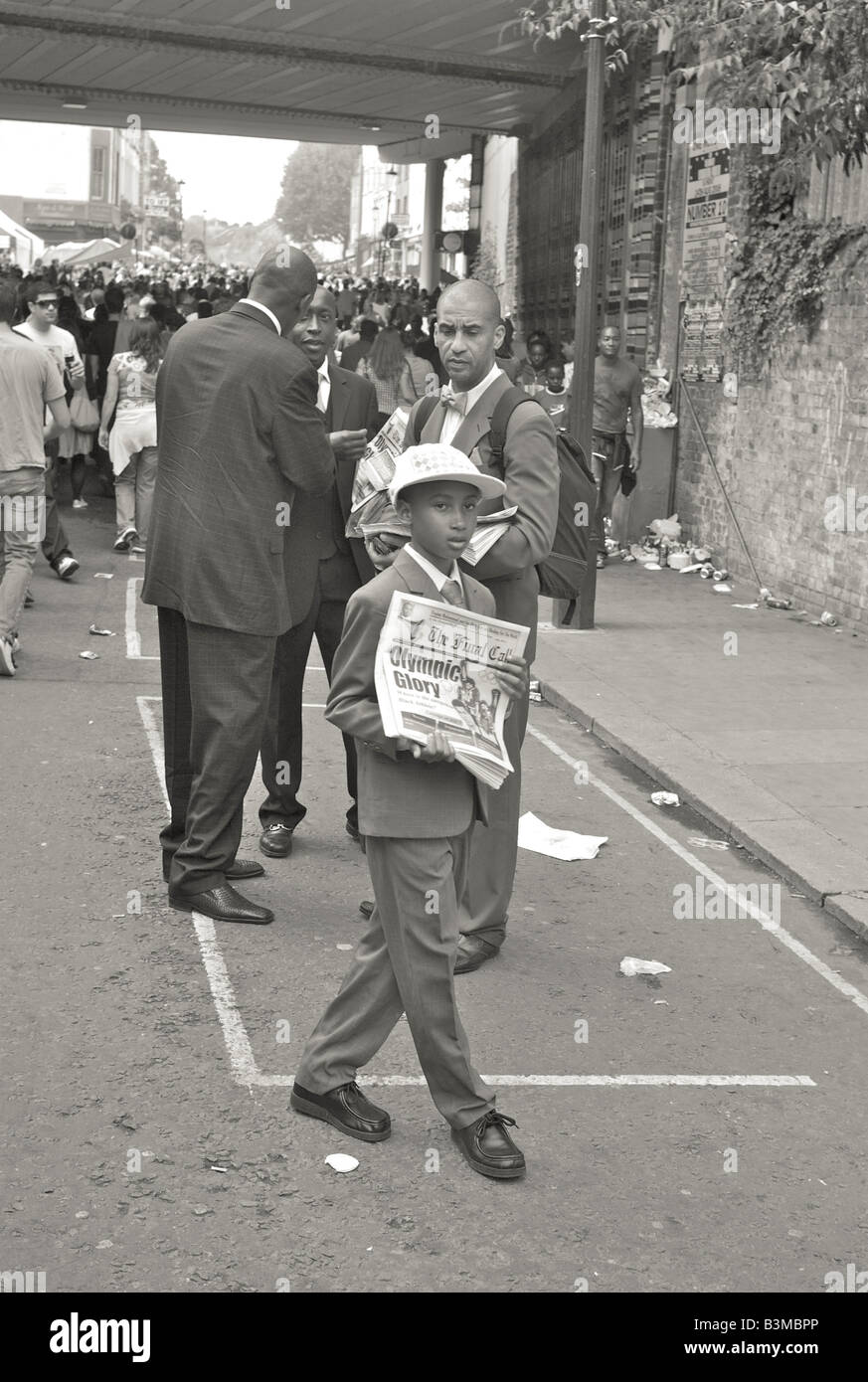 kids selling news paper at the Carnival Notting hill London 2008 Stock ...