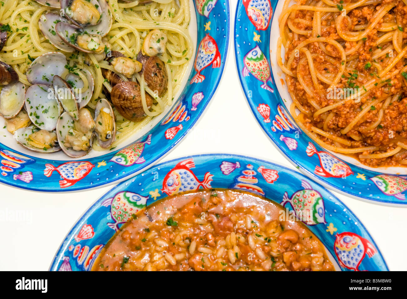 Tris of Italian Pasta and Rice Spaghetti with Clams Spaghetti with mix ...