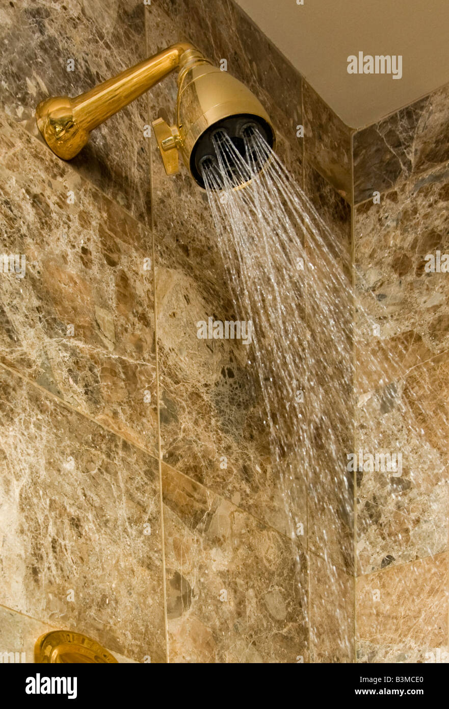 running shower in luxury hotel marble tiles Stock Photo - Alamy