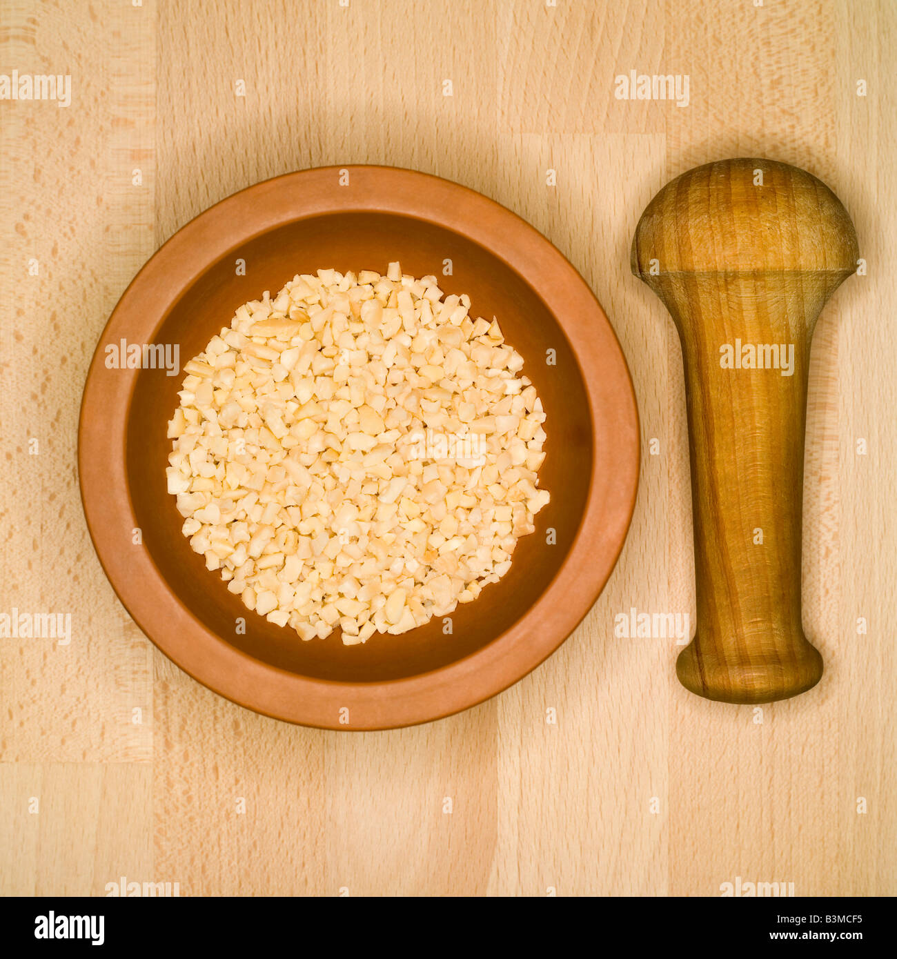Almond slivers in mortar, elevated view Stock Photo - Alamy