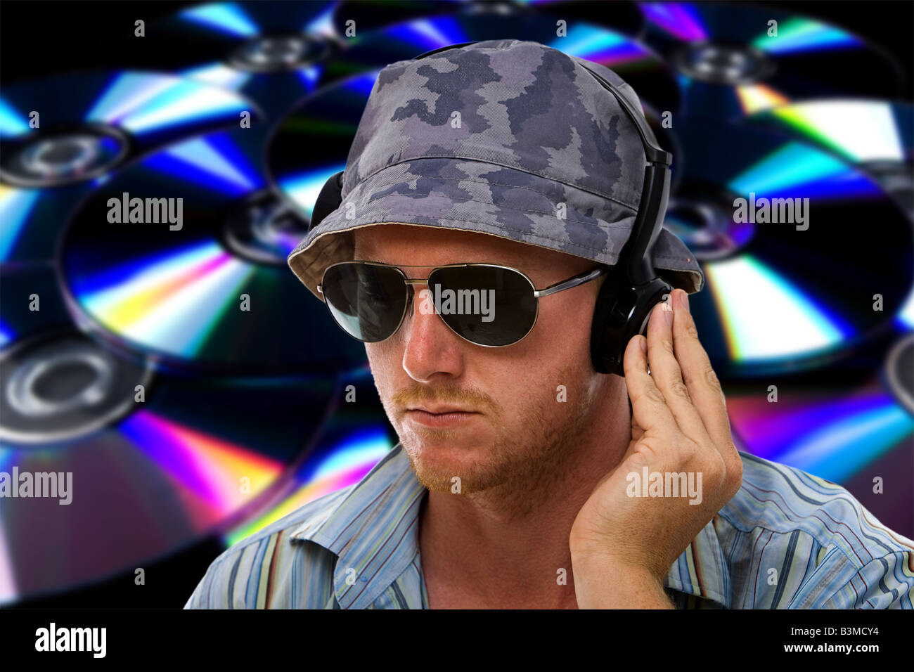 DJ with Hand on Headphones against an Abstract CD Background Stock ...