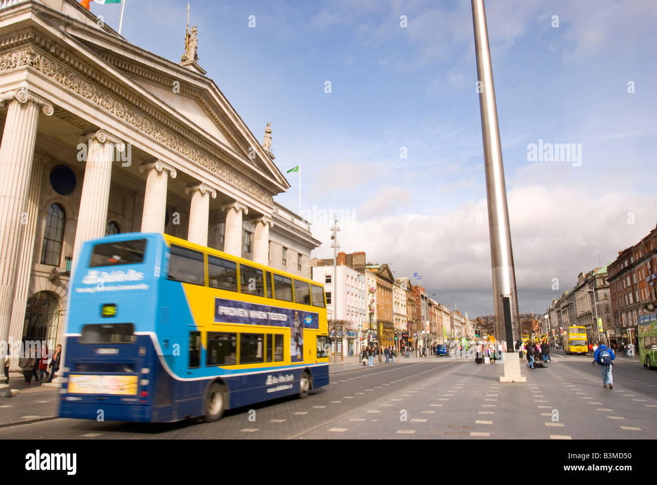 A public transport bus drives past the General Post Office building ...