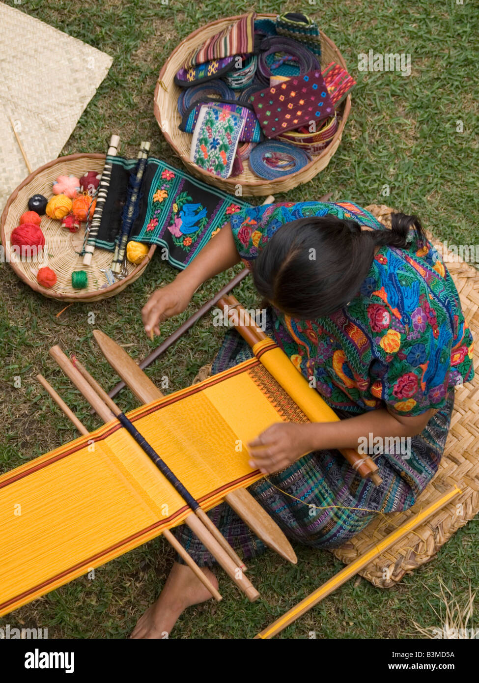 A weaver in indigenous dress at work Stock Photo - Alamy