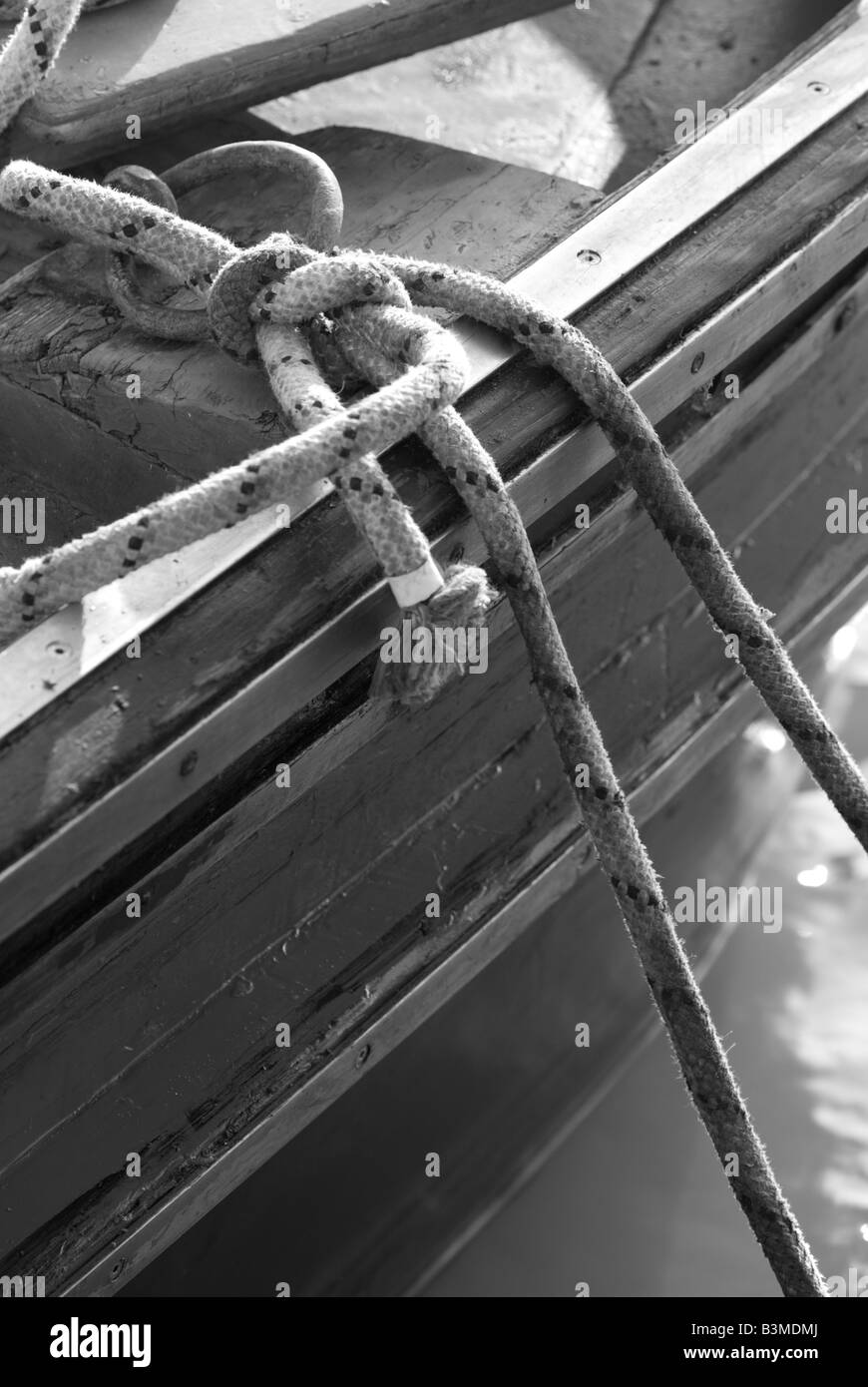 An old worn rope ties a small boat to the dock in Venice Italy Stock ...