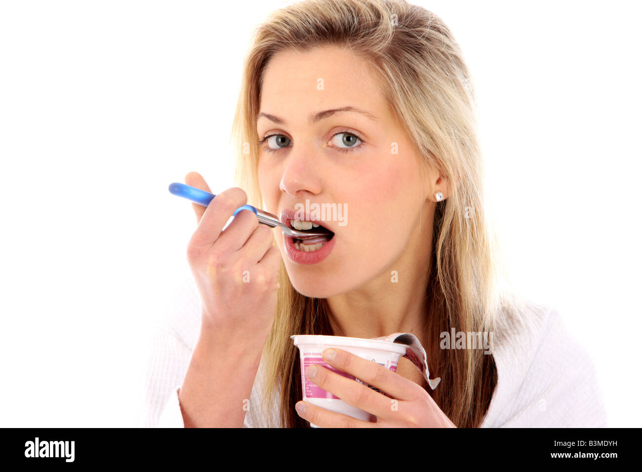 Young Woman Eating Raspberry Yogurt Model Released Stock Photo - Alamy