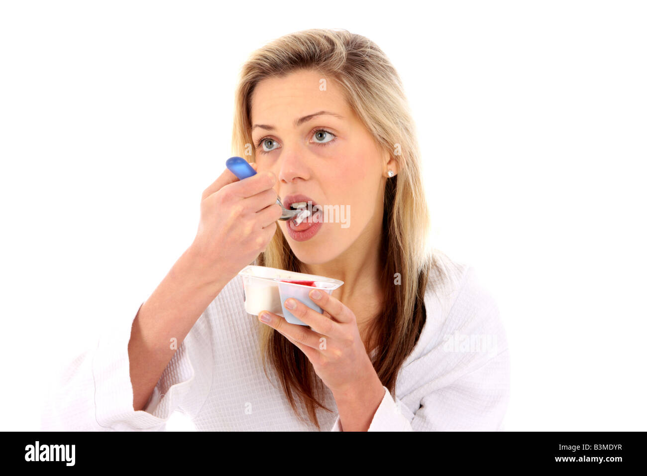 Young Woman Eating Strawberry Yoghurt Model Released Stock Photo - Alamy