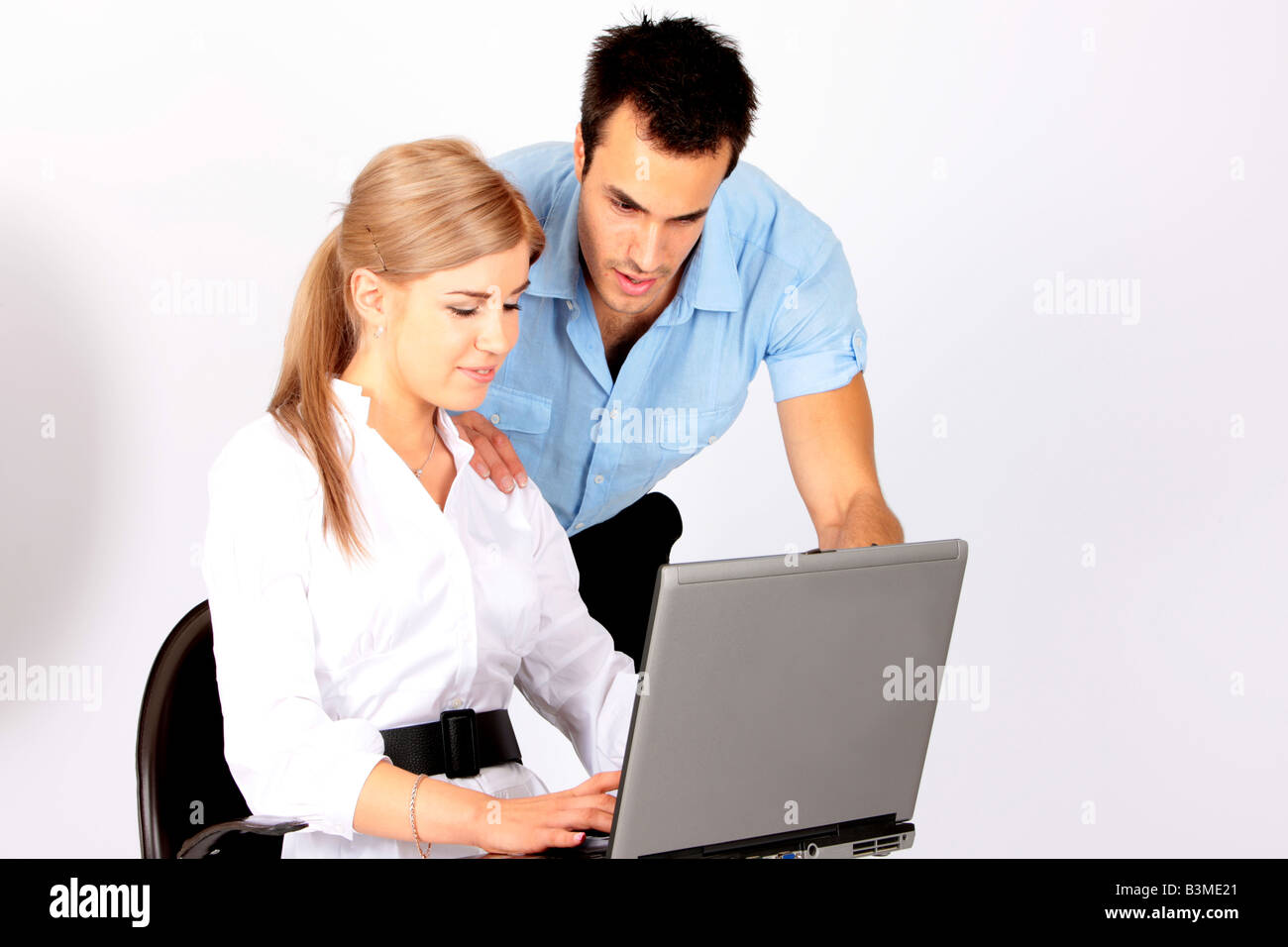 Young Man And Woman Working Business Partners Studying A Laptop ...