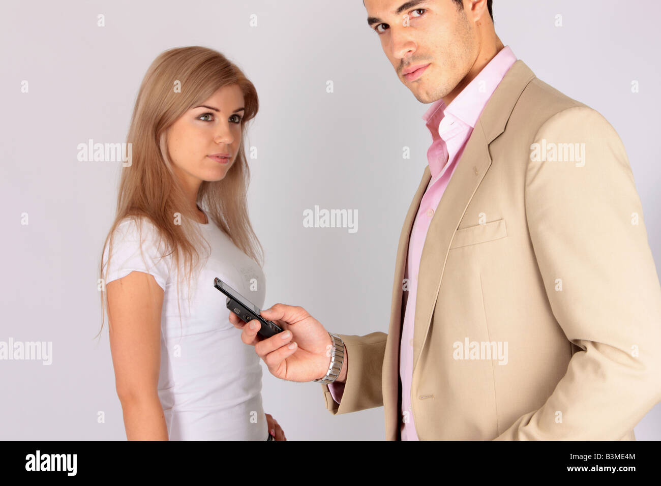Couple Using Mobile Phone Models Released Stock Photo - Alamy