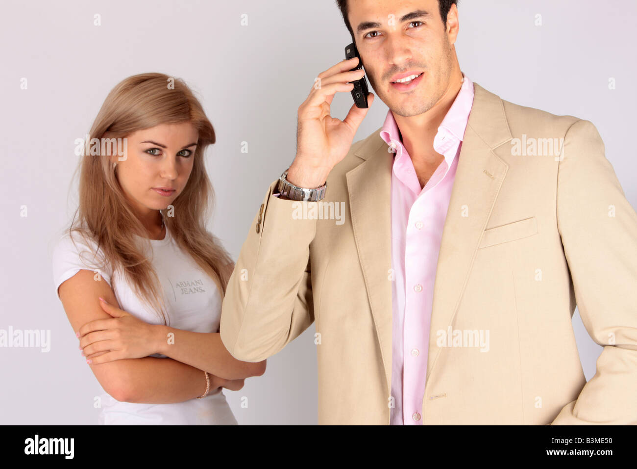 Couple Using Mobile Phone Models Released Stock Photo - Alamy