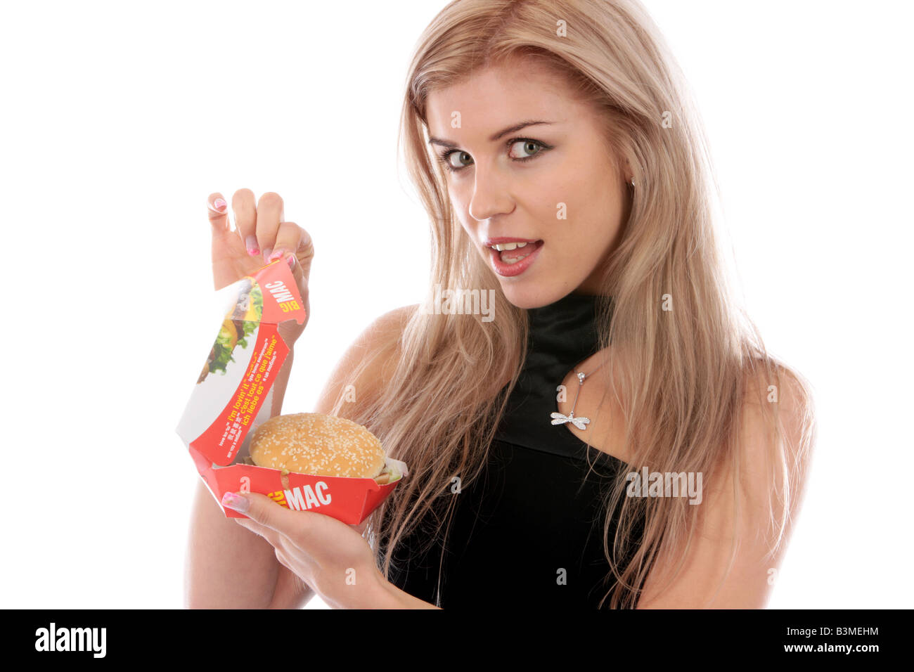 Young Woman Eating Hamburger Model Released Stock Photo - Alamy