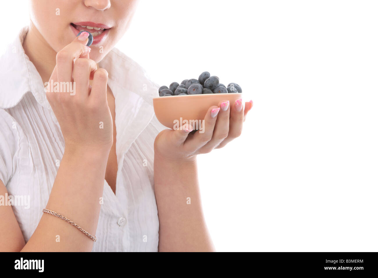 Young woman eating blueberry model hi-res stock photography and images ...