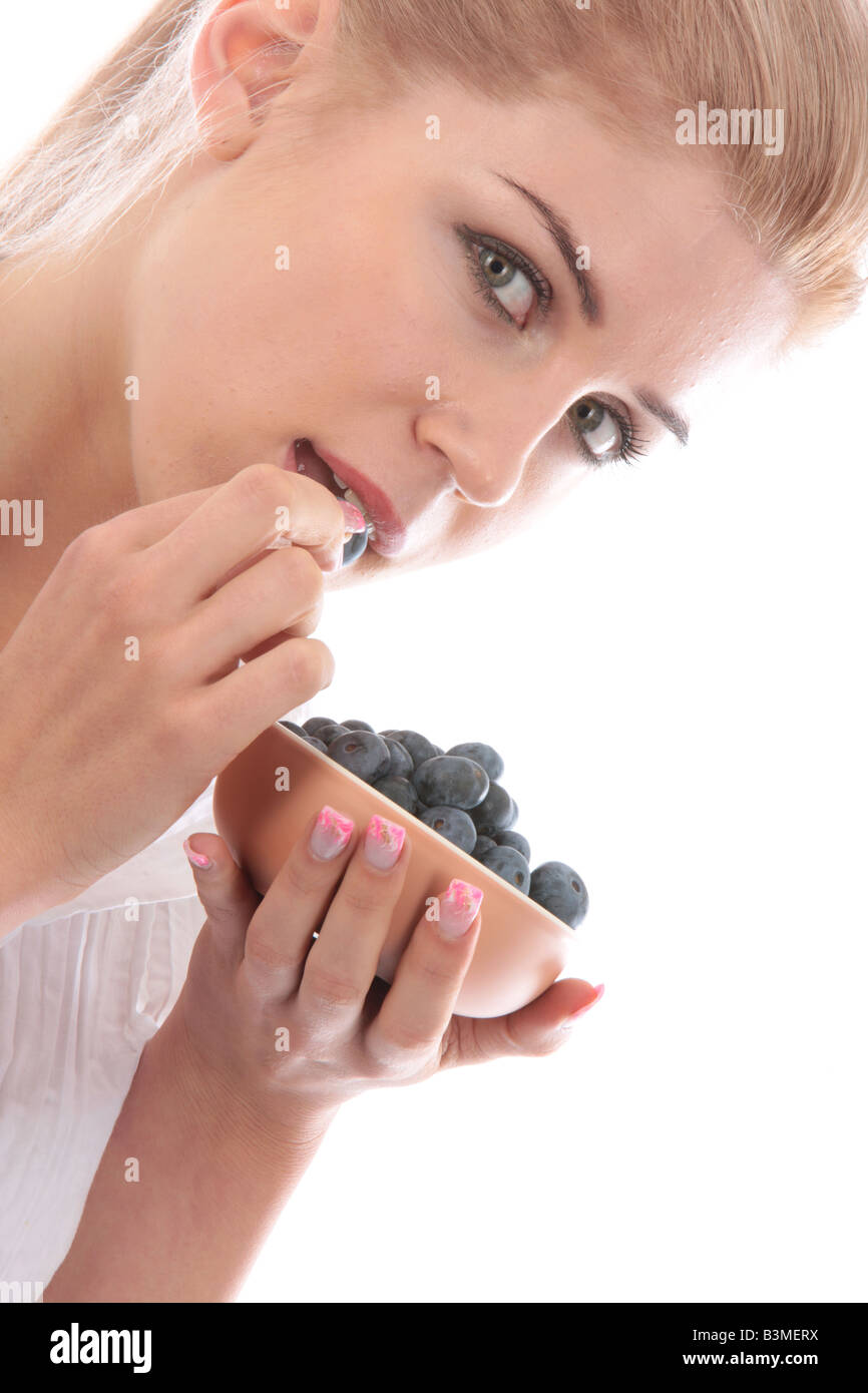 Young Woman Eating Blueberries Model Released Stock Photo - Alamy