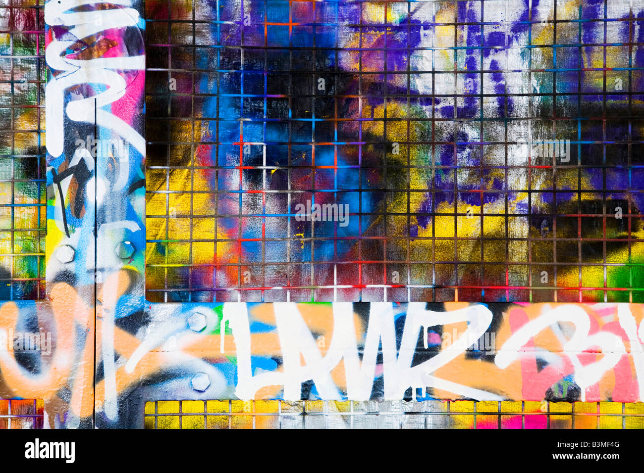 Graffiti on a chain link fence, ideal for an urban border or template ...