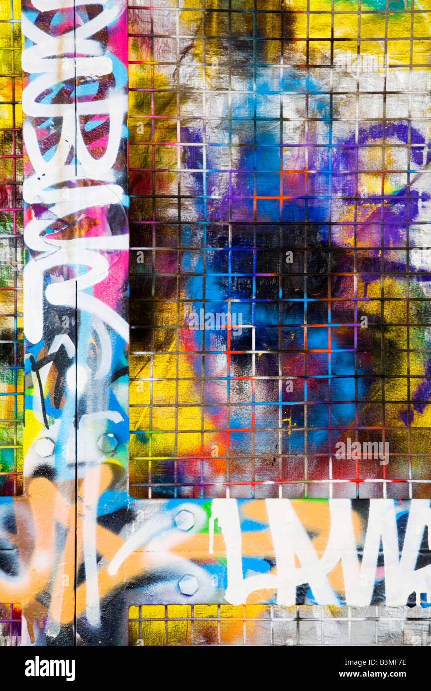 Graffiti on a chain link fence, ideal for an urban border or template ...