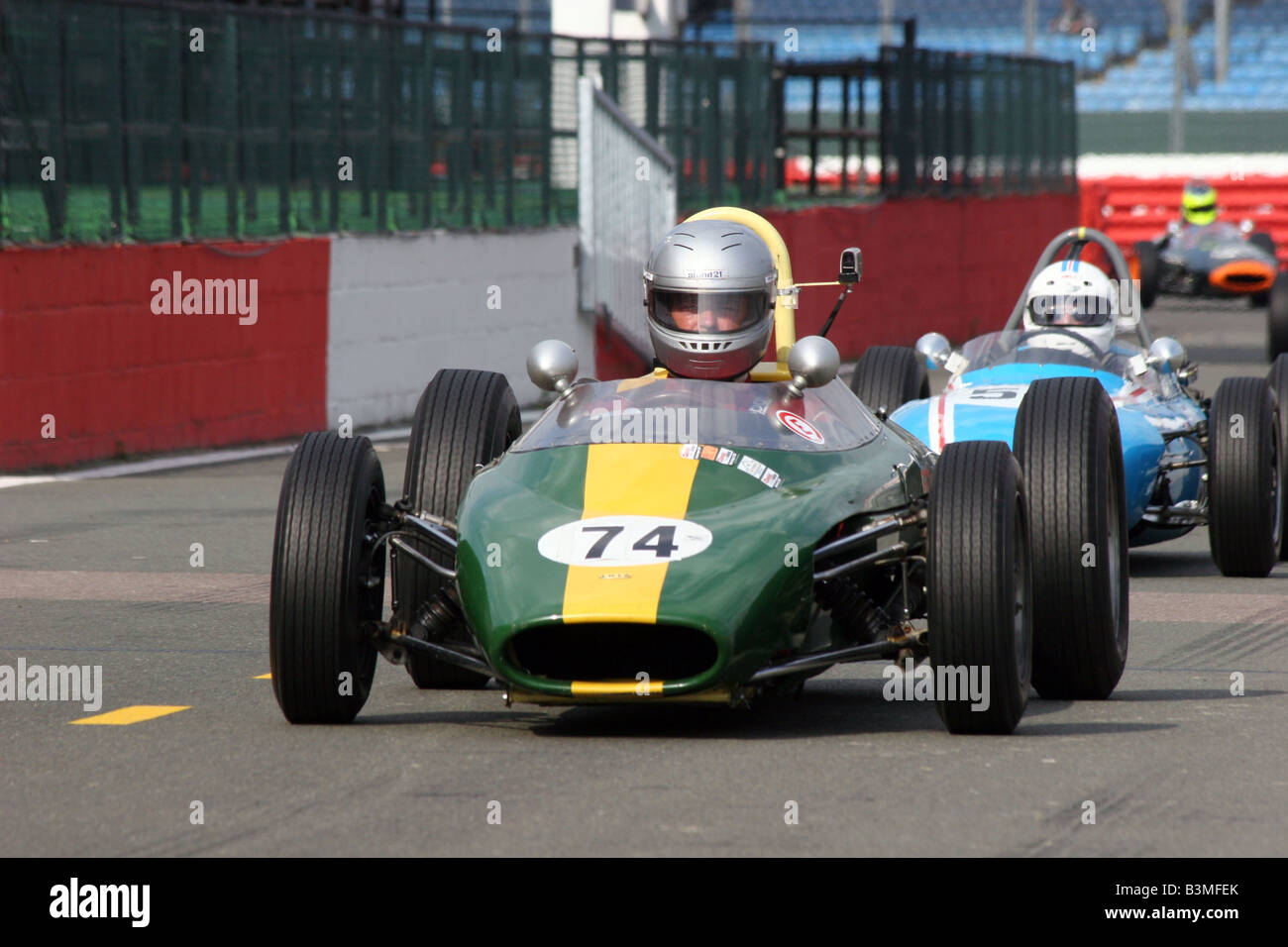 green racing car crossing the starting line Silverstone Stock Photo - Alamy