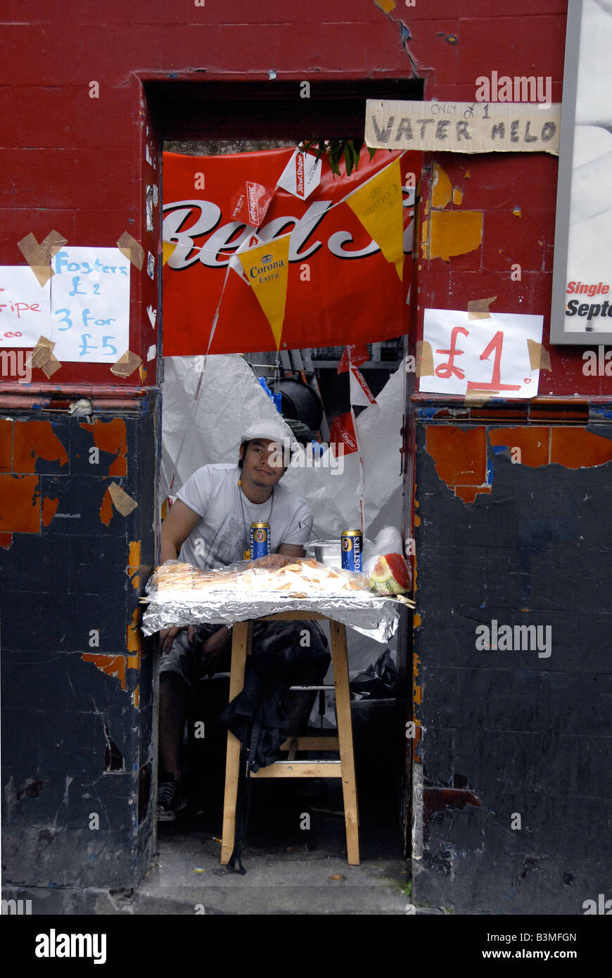 Hole in wall shop Notting Hill Carnival Stock Photo - Alamy