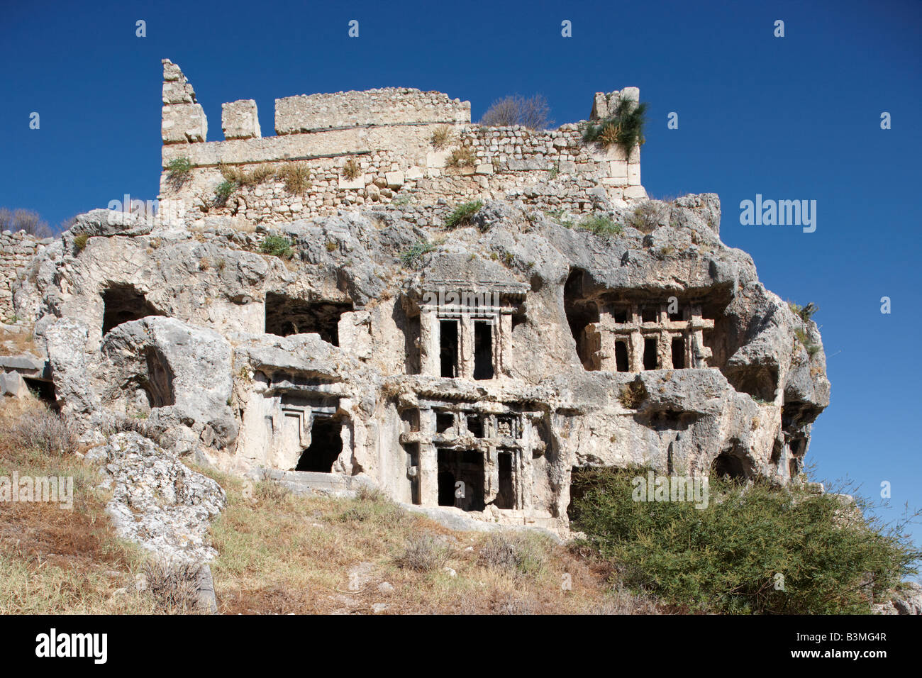 Ancient Lycian house-type rock-cut tombs on the Tlos acropolis. South ...